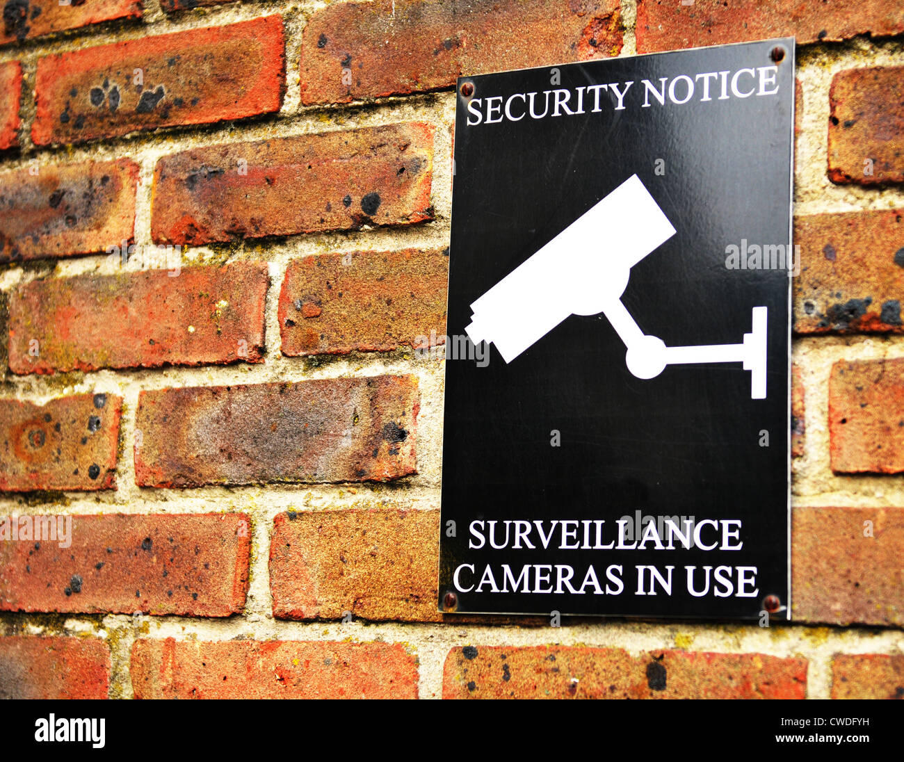 Surveillance camera sign on old wall Stock Photo - Alamy