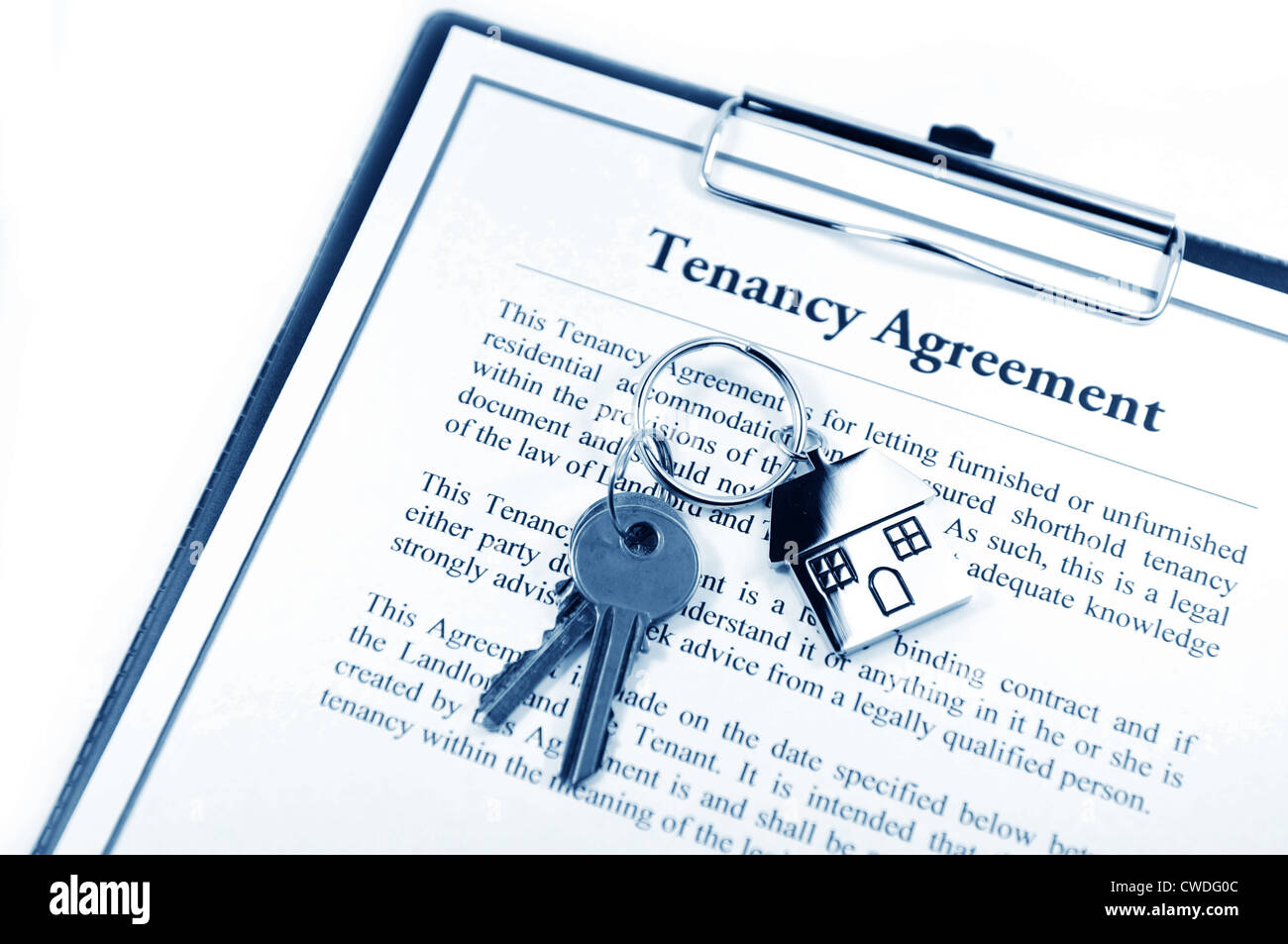 Tenancy agreement and key with symbolic house key ring Stock Photo - Alamy