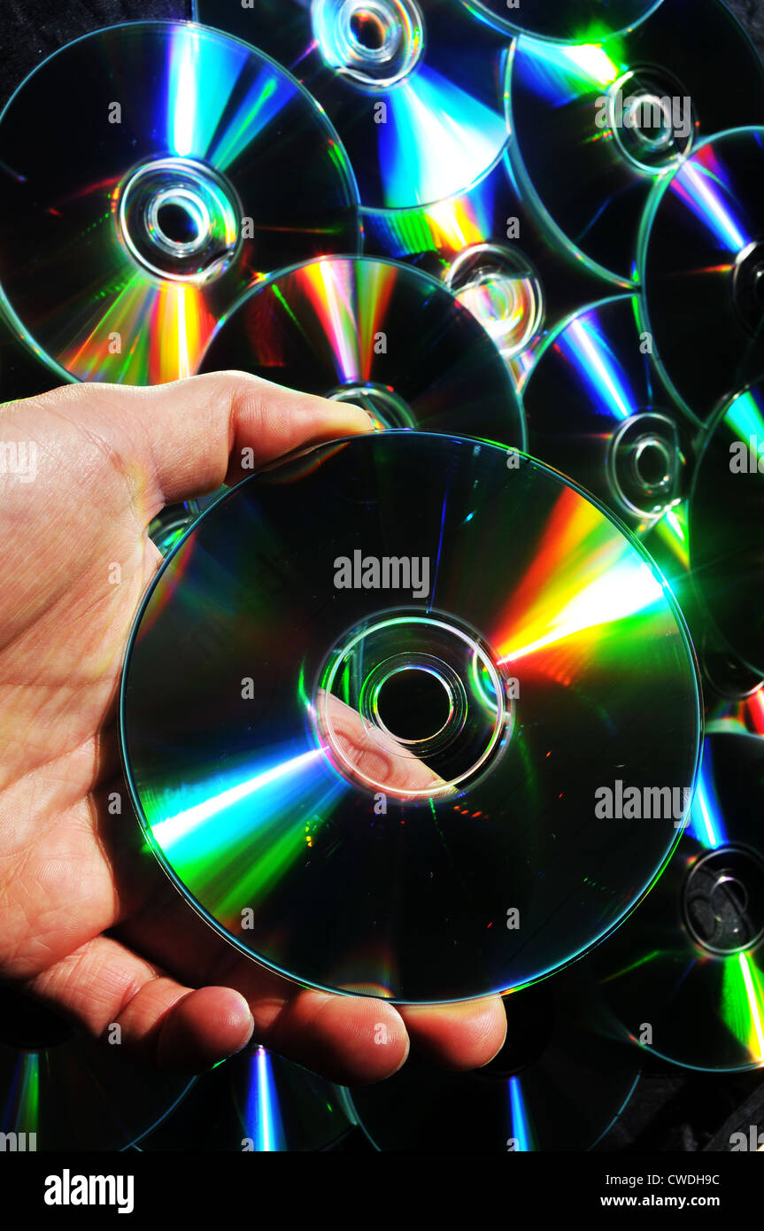 Disk jockey showing colorful music compact disk Stock Photo - Alamy