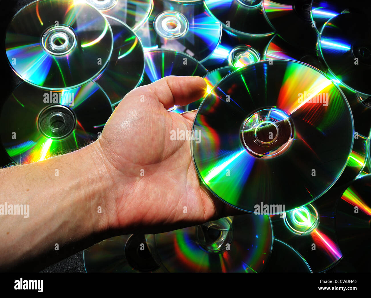Disk jockey showing colorful music compact disk Stock Photo - Alamy