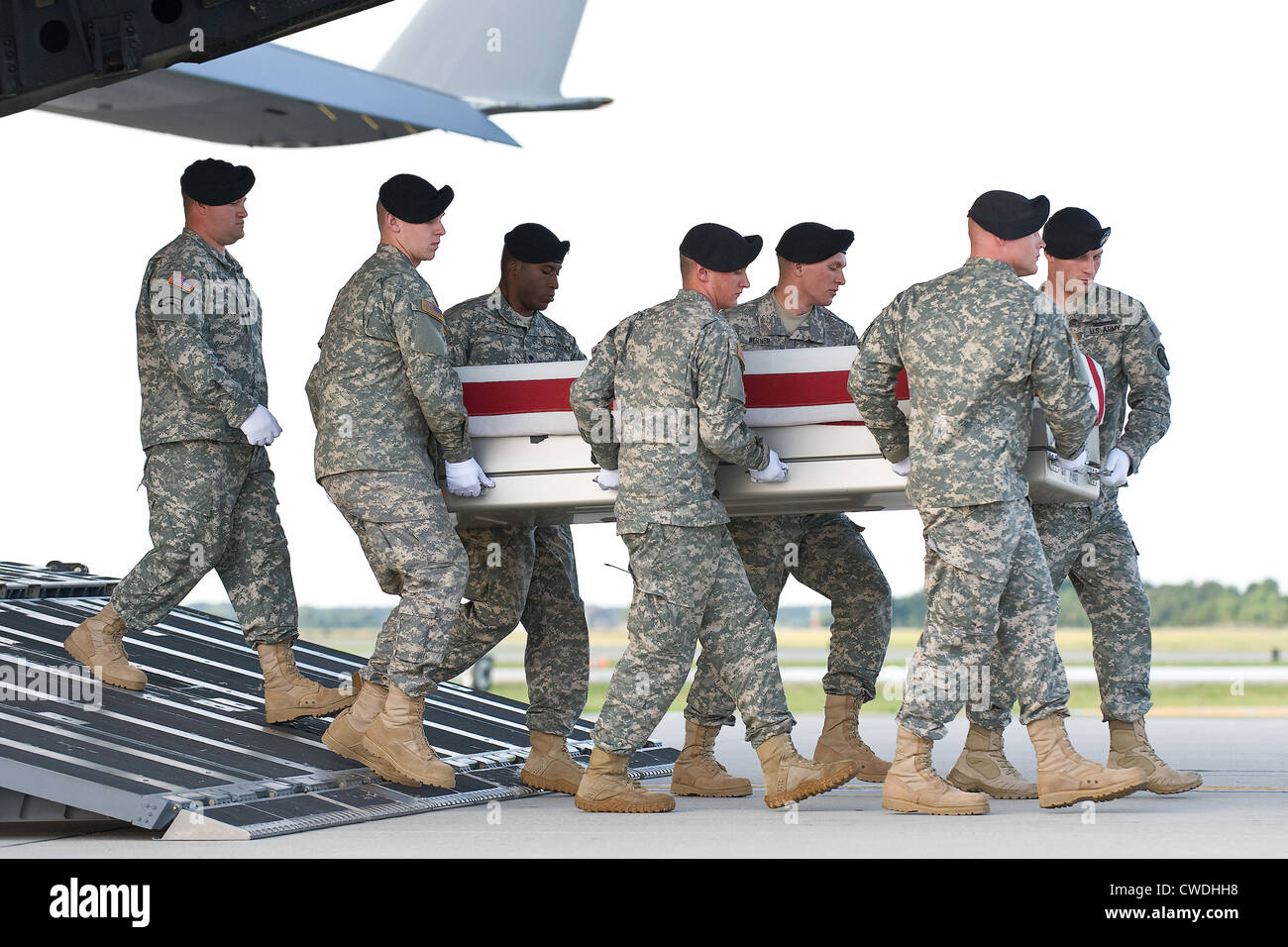 A US Army carry team transfers the remains of a fallen soldier June 5 ...