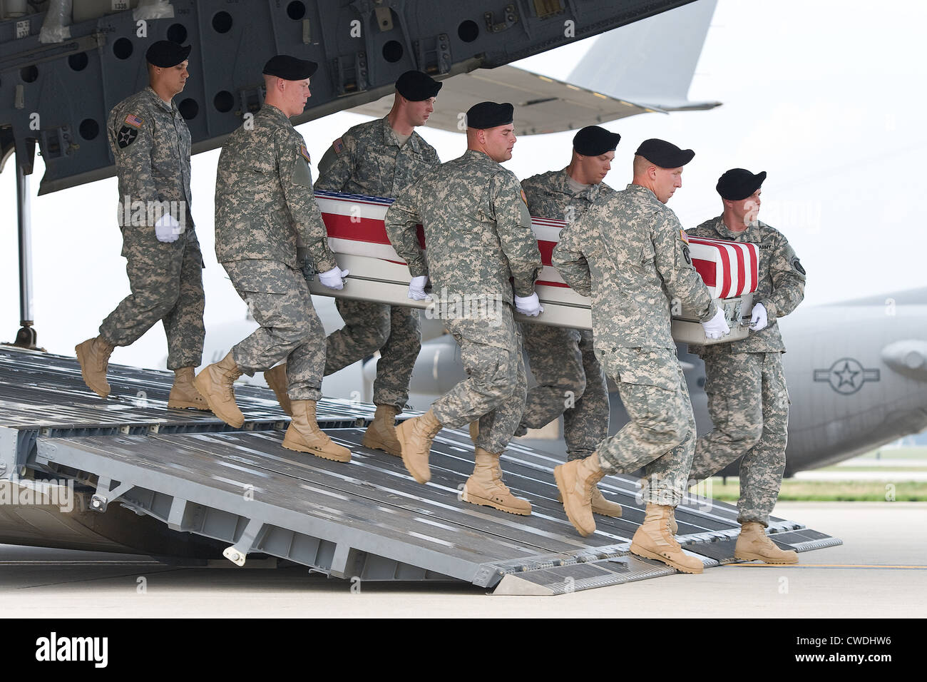 A US Army carry team transfers the remains of a fallen soldier July 24 ...