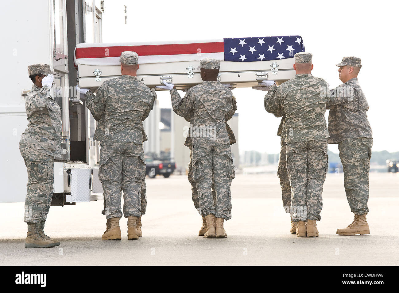 A US Army carry team transfers the remains of a fallen soldier July 30 ...