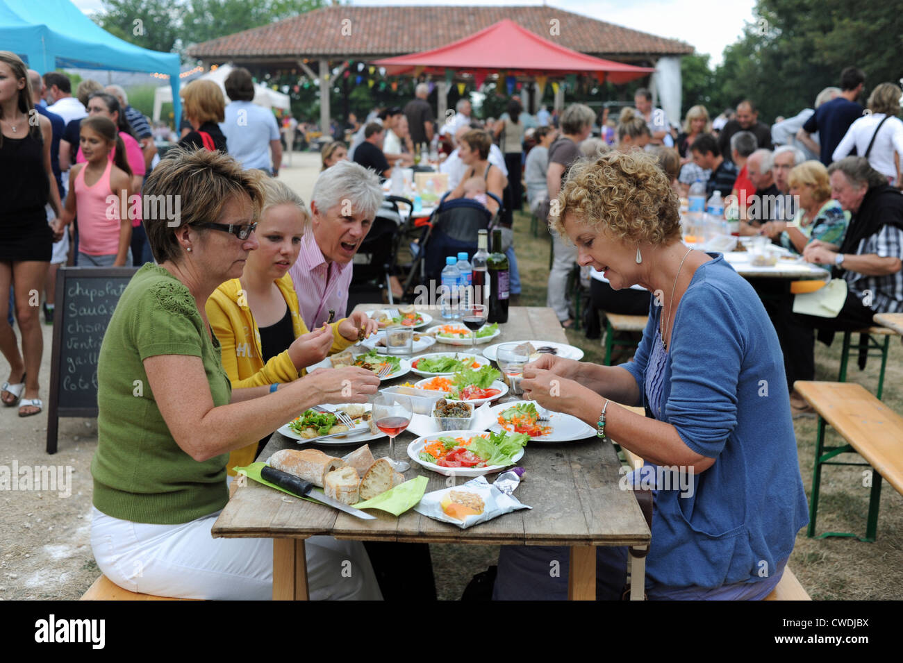 Enjoying the village picnic evening at Loubejac in South West France ...