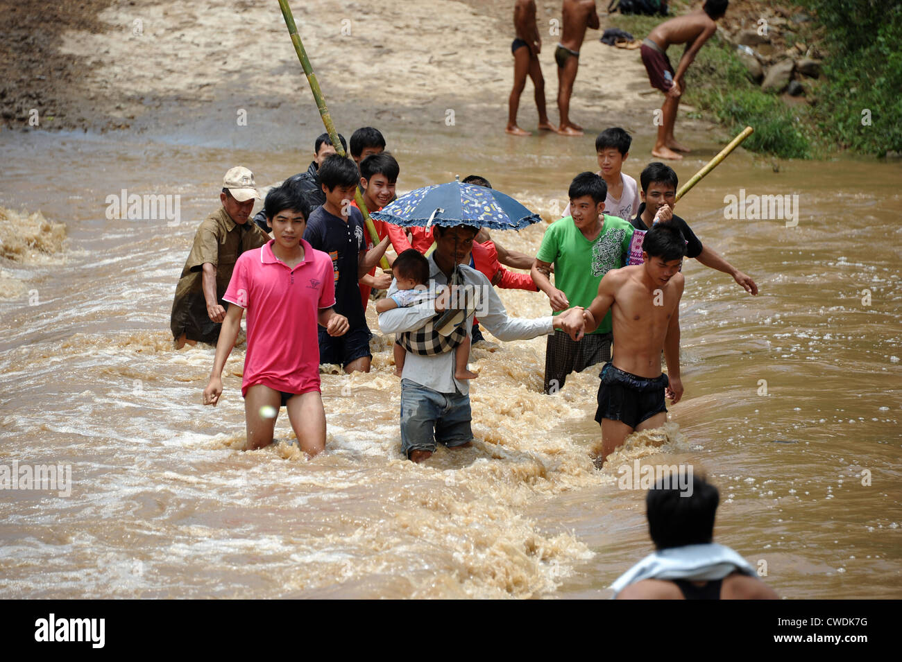 Man walking through flood water hi-res stock photography and images - Alamy