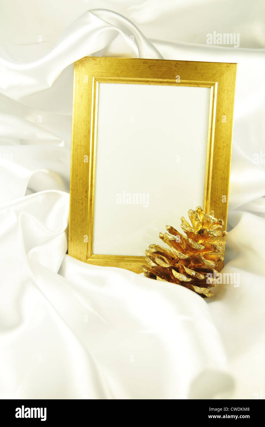 Beautiful golden frame against white silk satin Stock Photo - Alamy