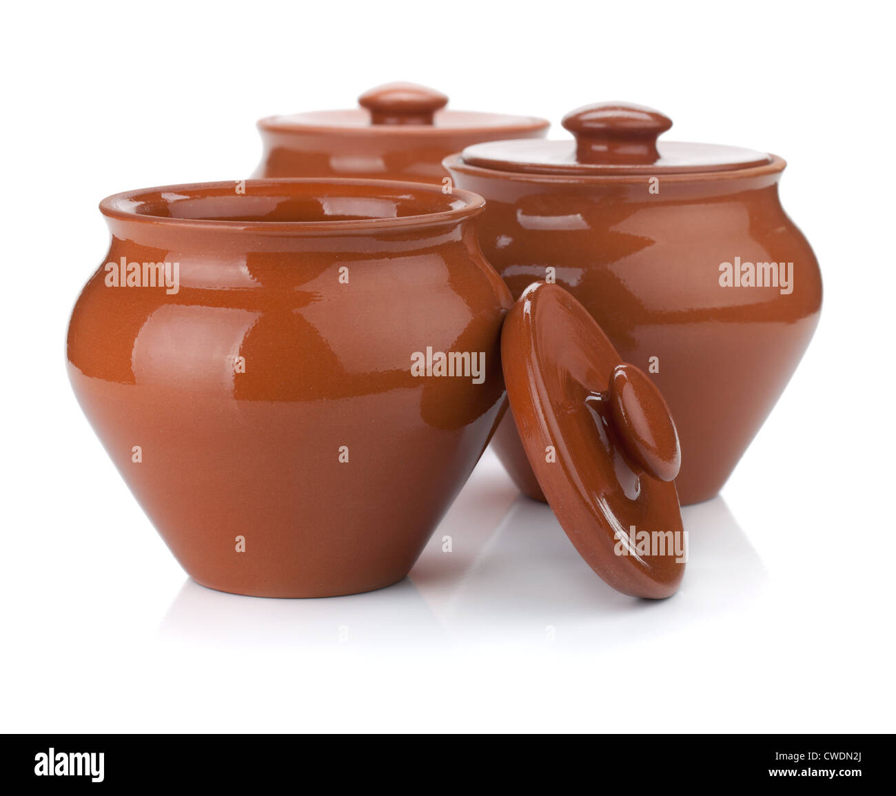 Three clay pots. Isolated on white background Stock Photo - Alamy
