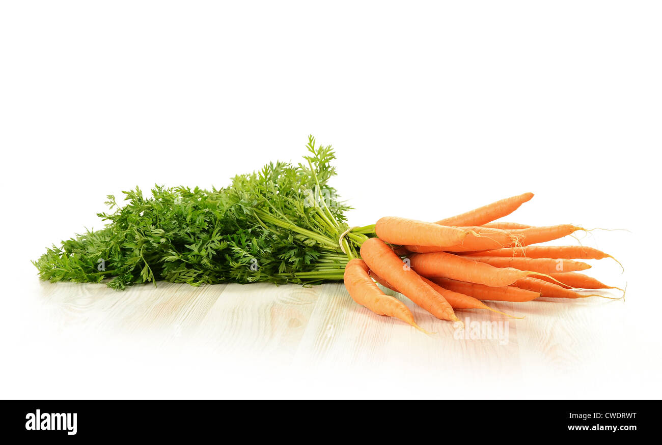 Raw carrot isolated on white Stock Photo - Alamy