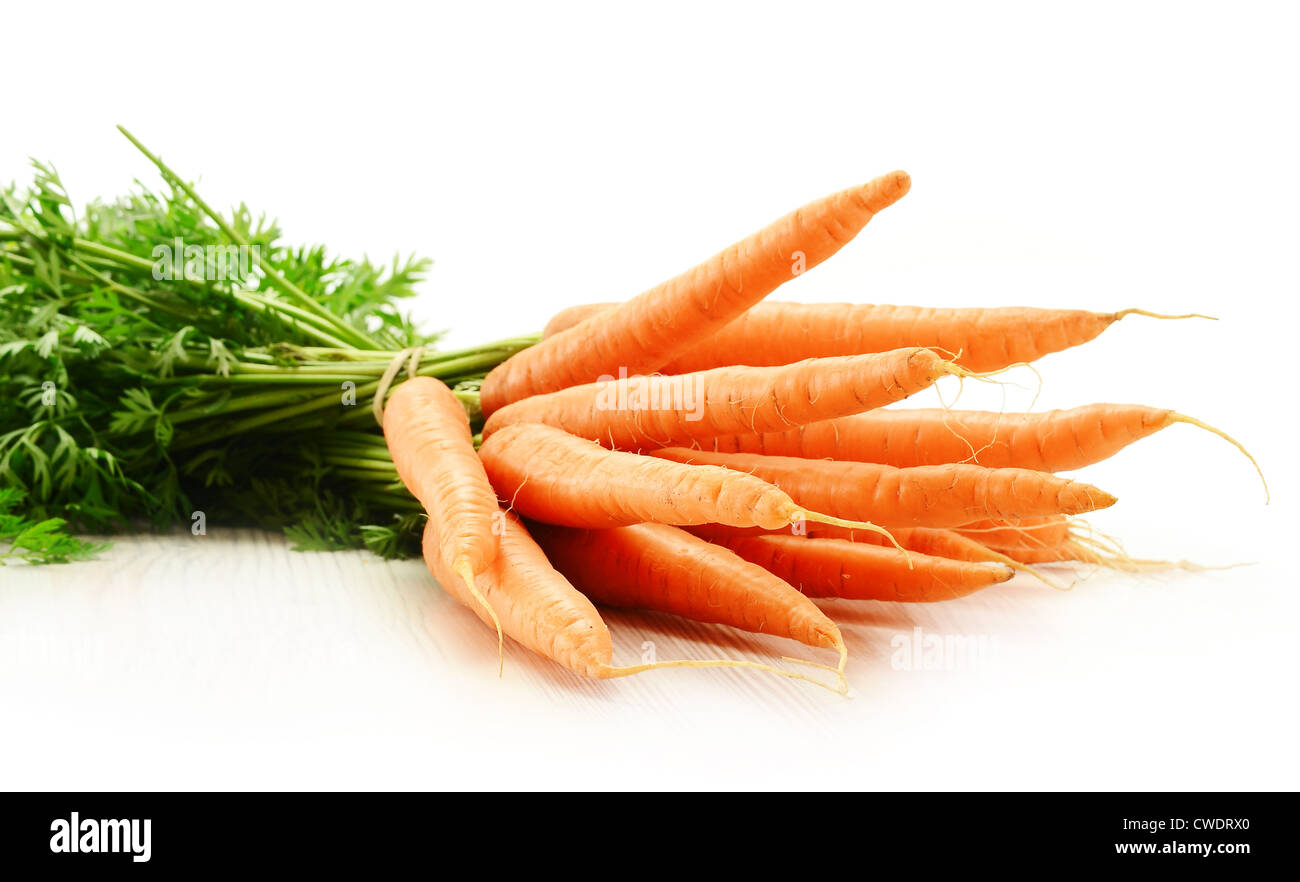 Raw carrot isolated on white Stock Photo - Alamy