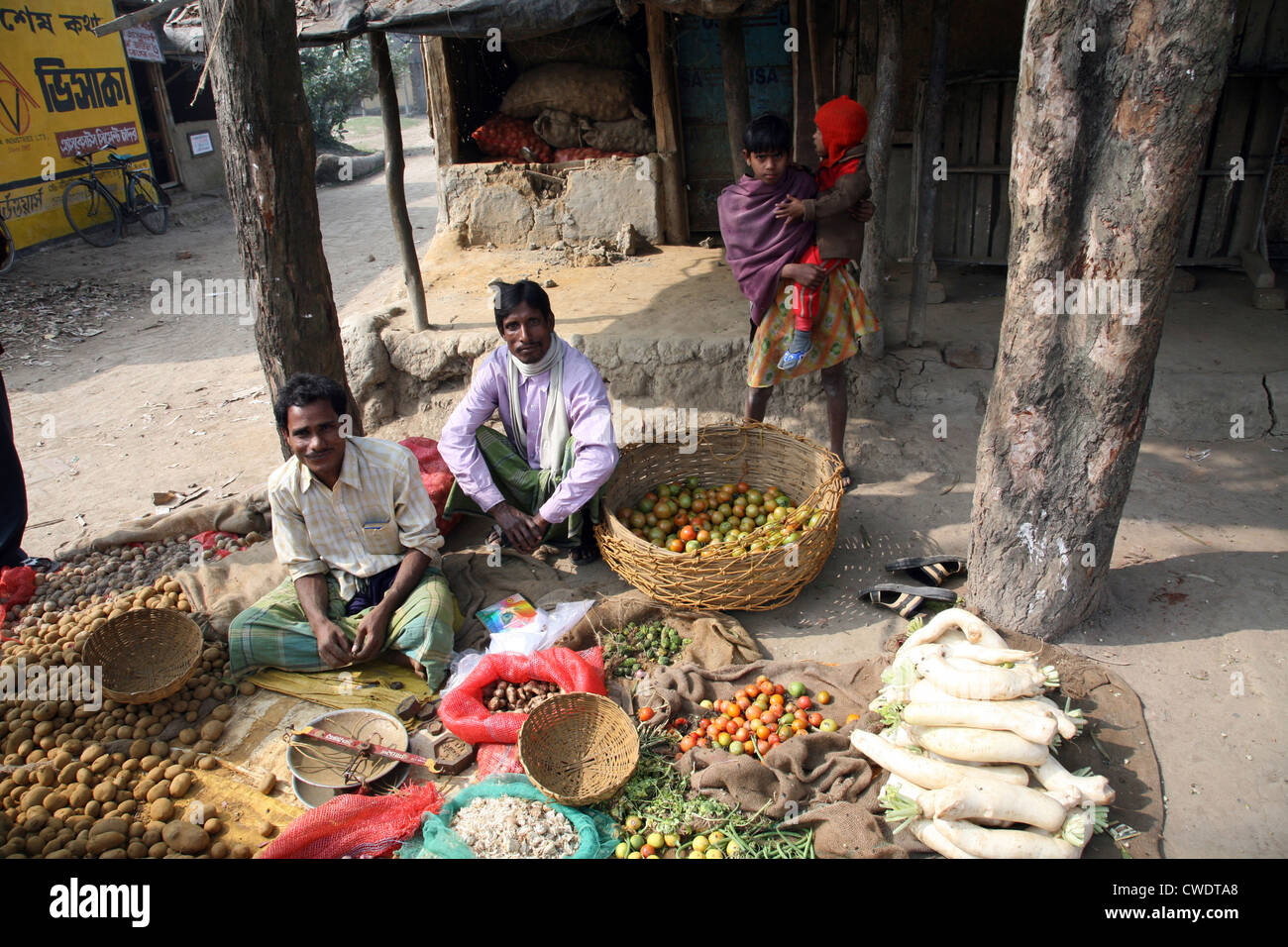 Tribal villagers bargain for vegetables on January 14, 2009. Kumrokhali ...