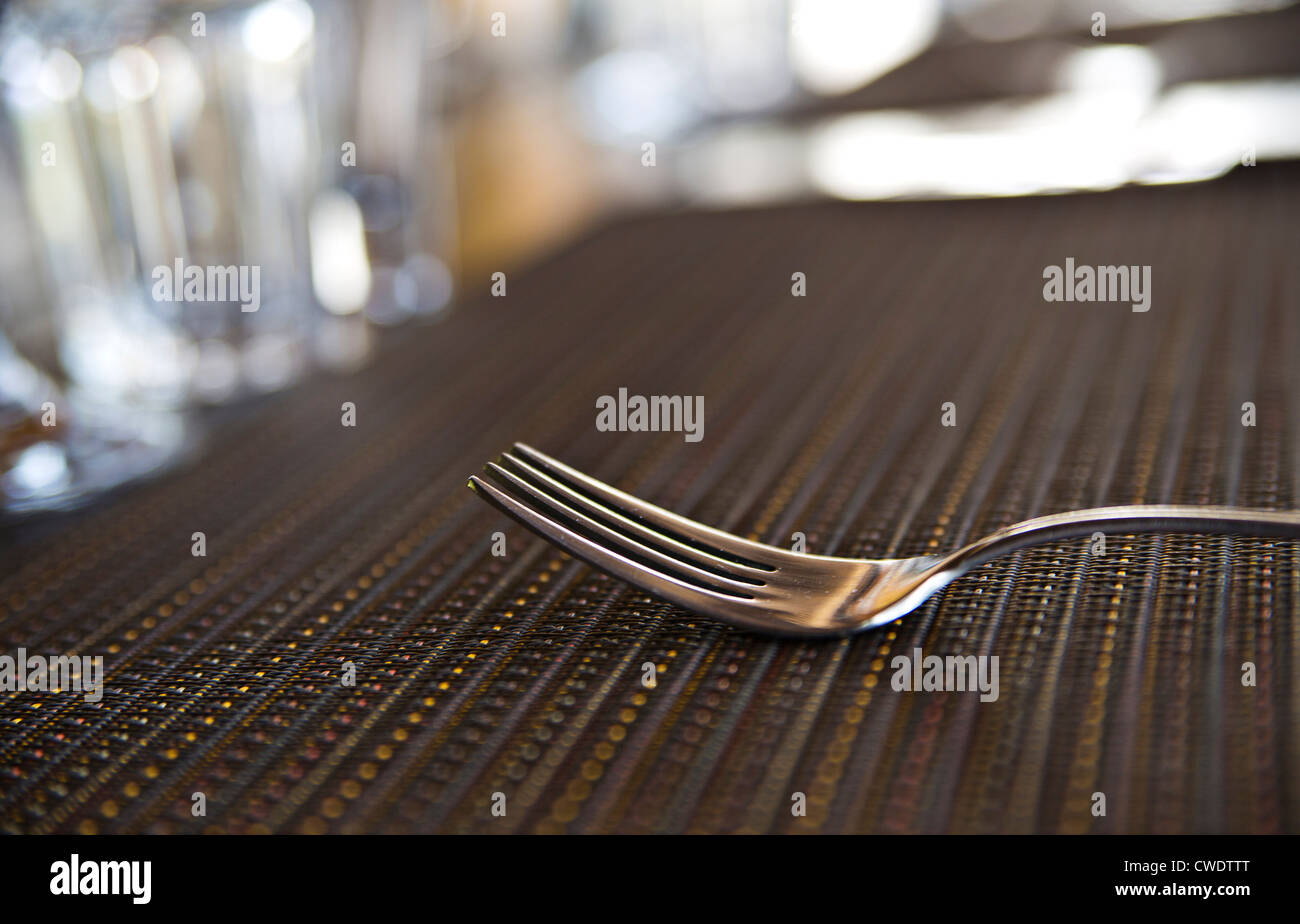 Lonely chromed fork on kitchen table is washed Stock Photo - Alamy