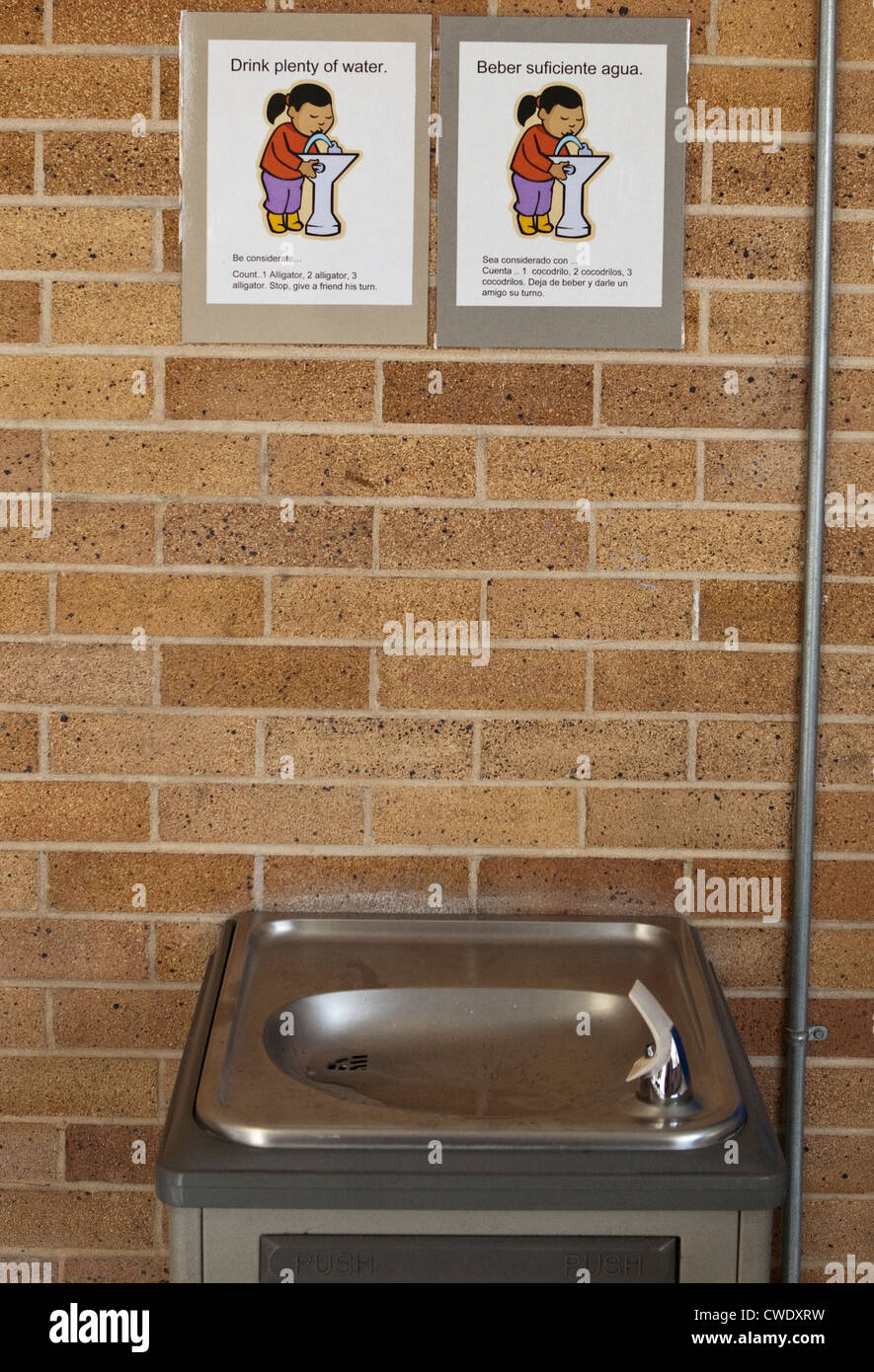 Bilingual sign in English and Spanish on wall of Elementary School in ...