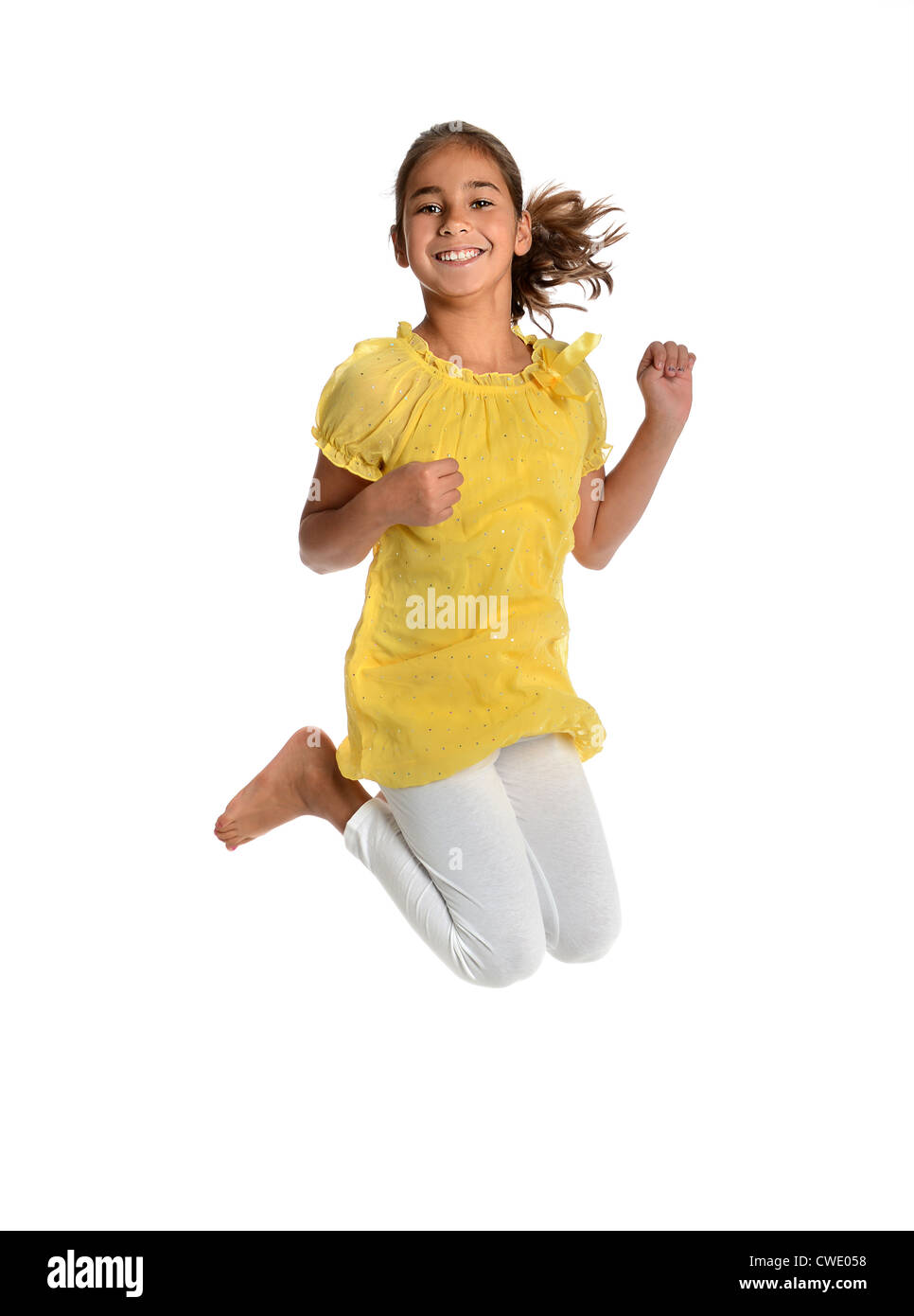 Young girl jumping isolated over white background Stock Photo - Alamy