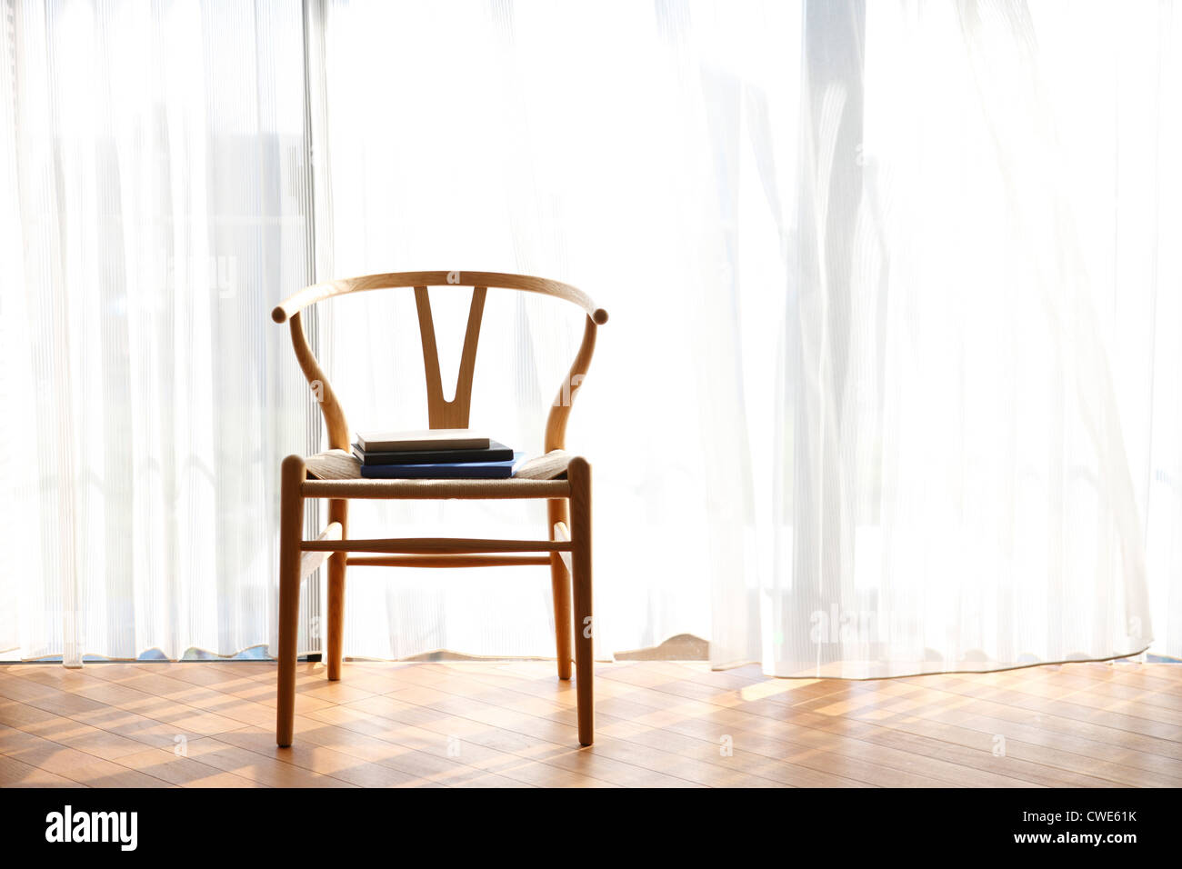 Books On Chair Stock Photo - Alamy