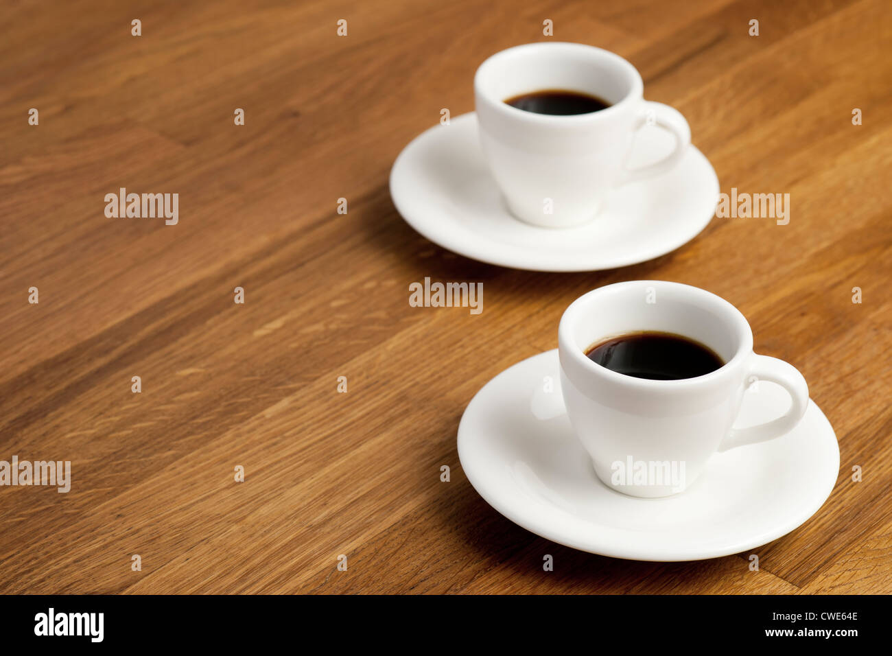 Two coffee cups on the table Stock Photo - Alamy