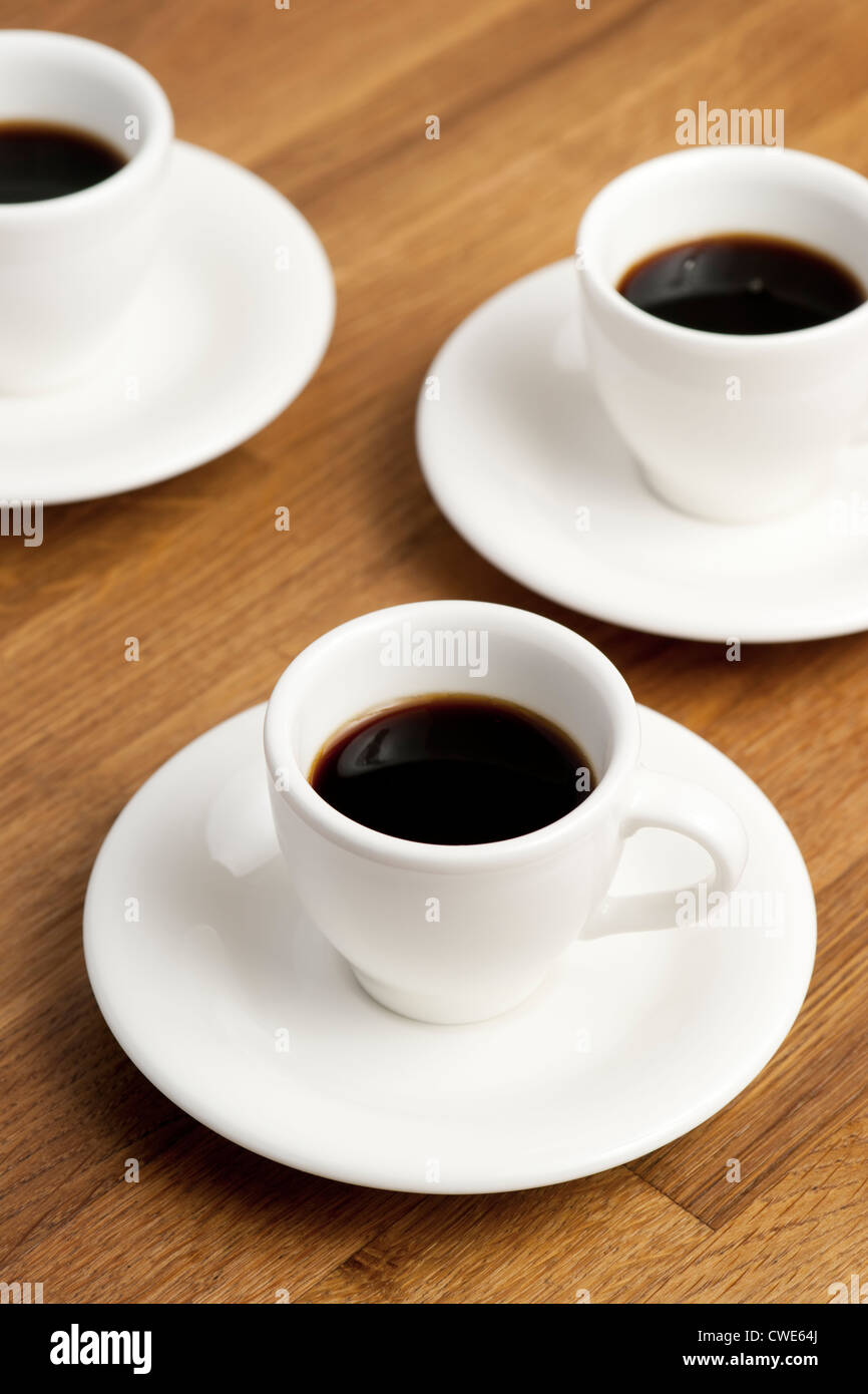 Three coffee cups on the table Stock Photo - Alamy