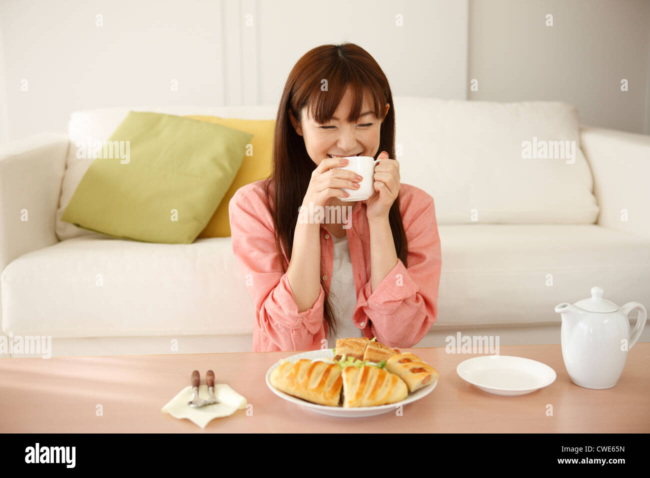 Young Woman Taking Breakfast Stock Photo - Alamy