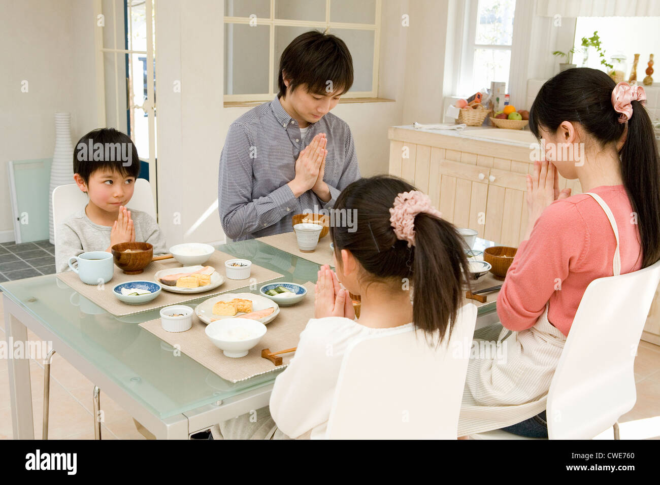 Family saying Itadakimasu before eating Stock Photo - Alamy