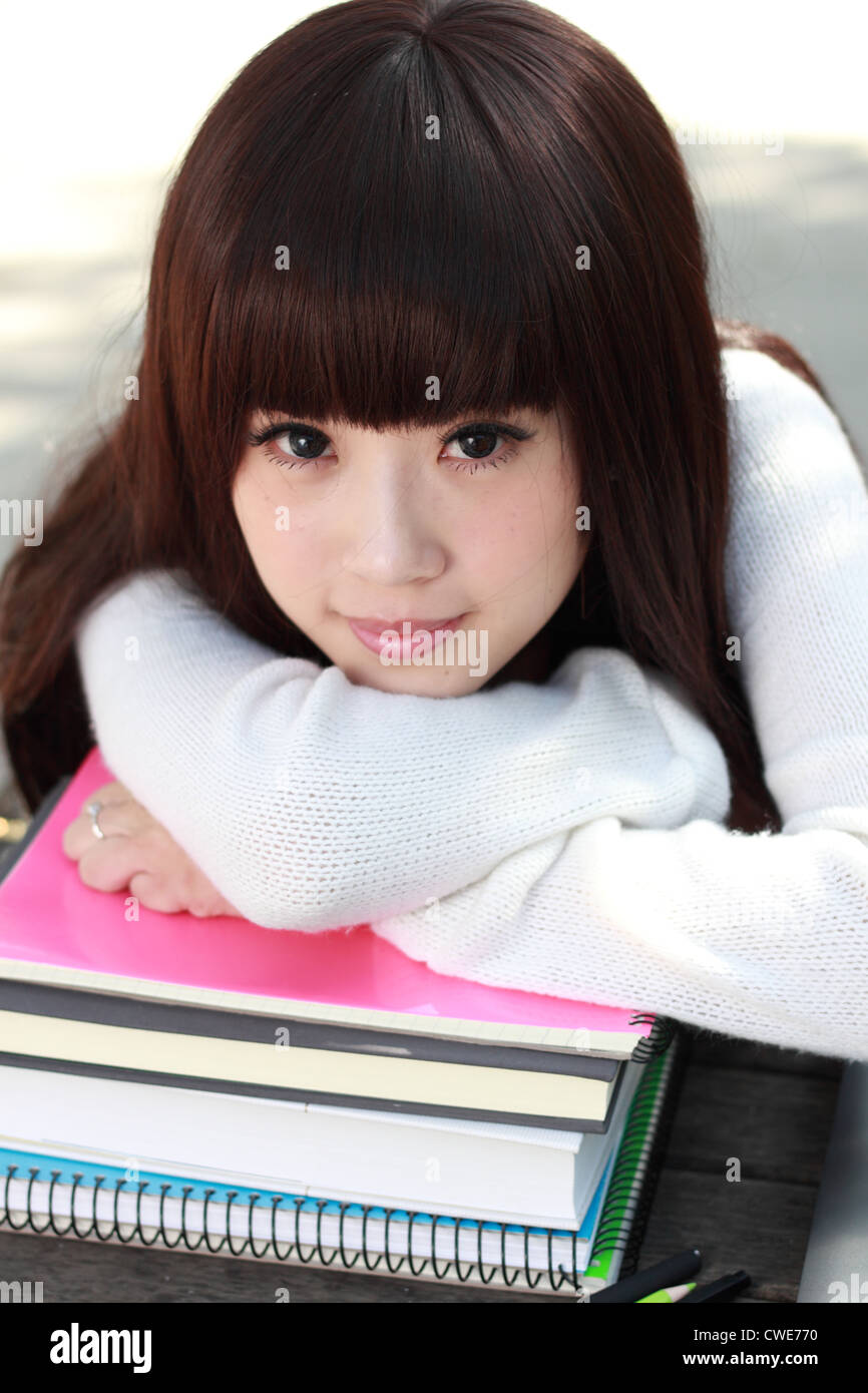 A smiling Asian student is studying Stock Photo - Alamy