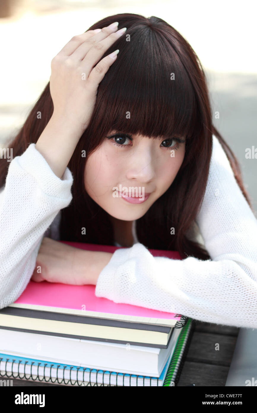 A smiling Asian student is studying Stock Photo - Alamy