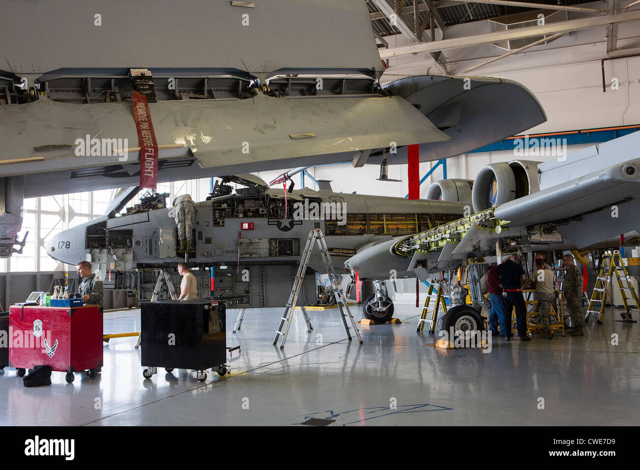 Airmen perform maintenance work on an A-10 Thunderbolt from the 354th ...