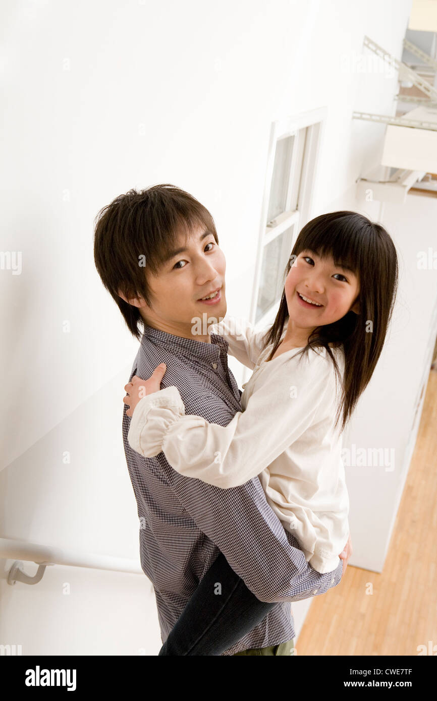 Father holding daughter Stock Photo - Alamy