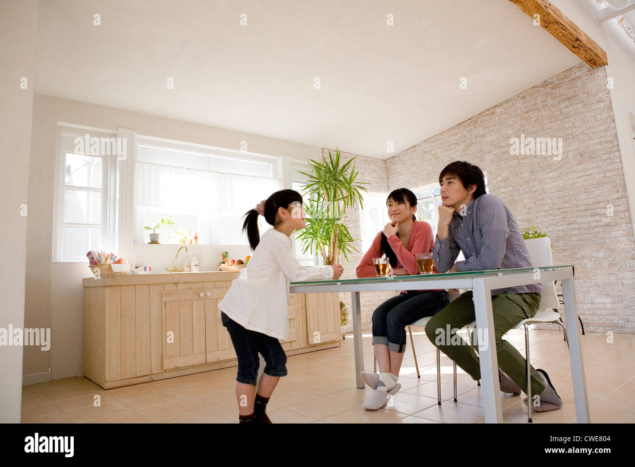 Daughter talking to parents Stock Photo - Alamy