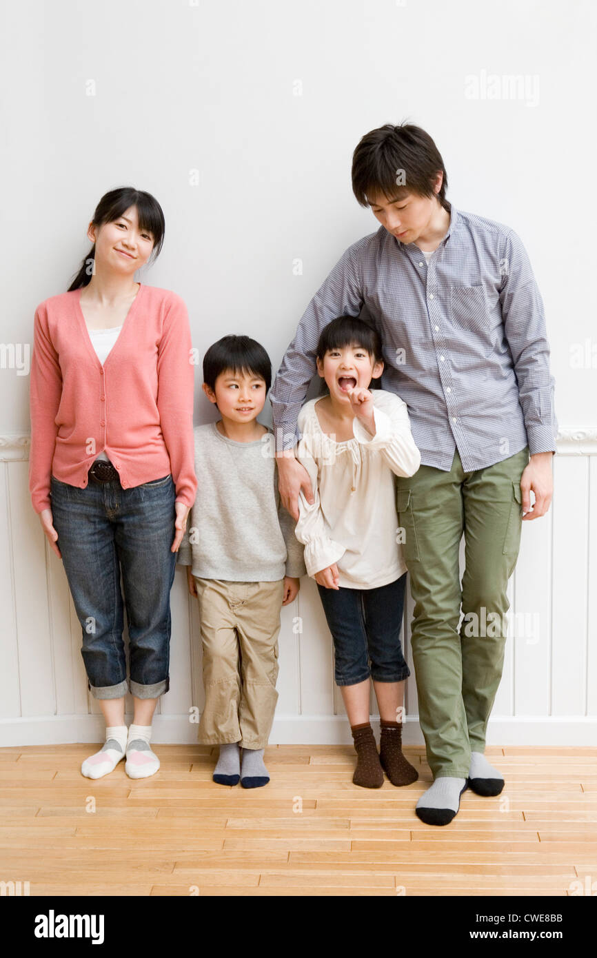 Family standing together Stock Photo - Alamy
