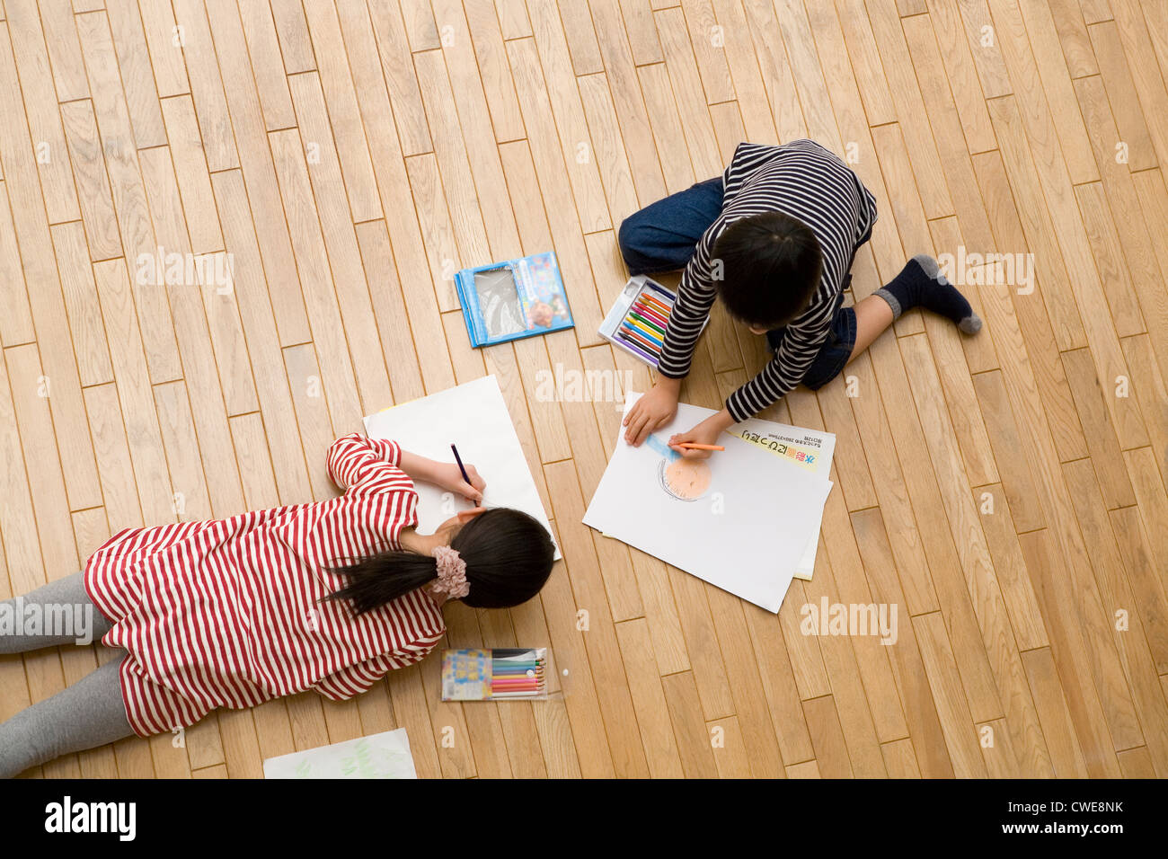 Two kids drawing picture Stock Photo - Alamy