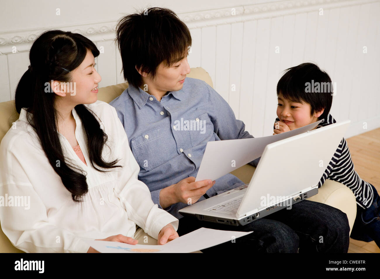 Parents looking son and picture Stock Photo - Alamy