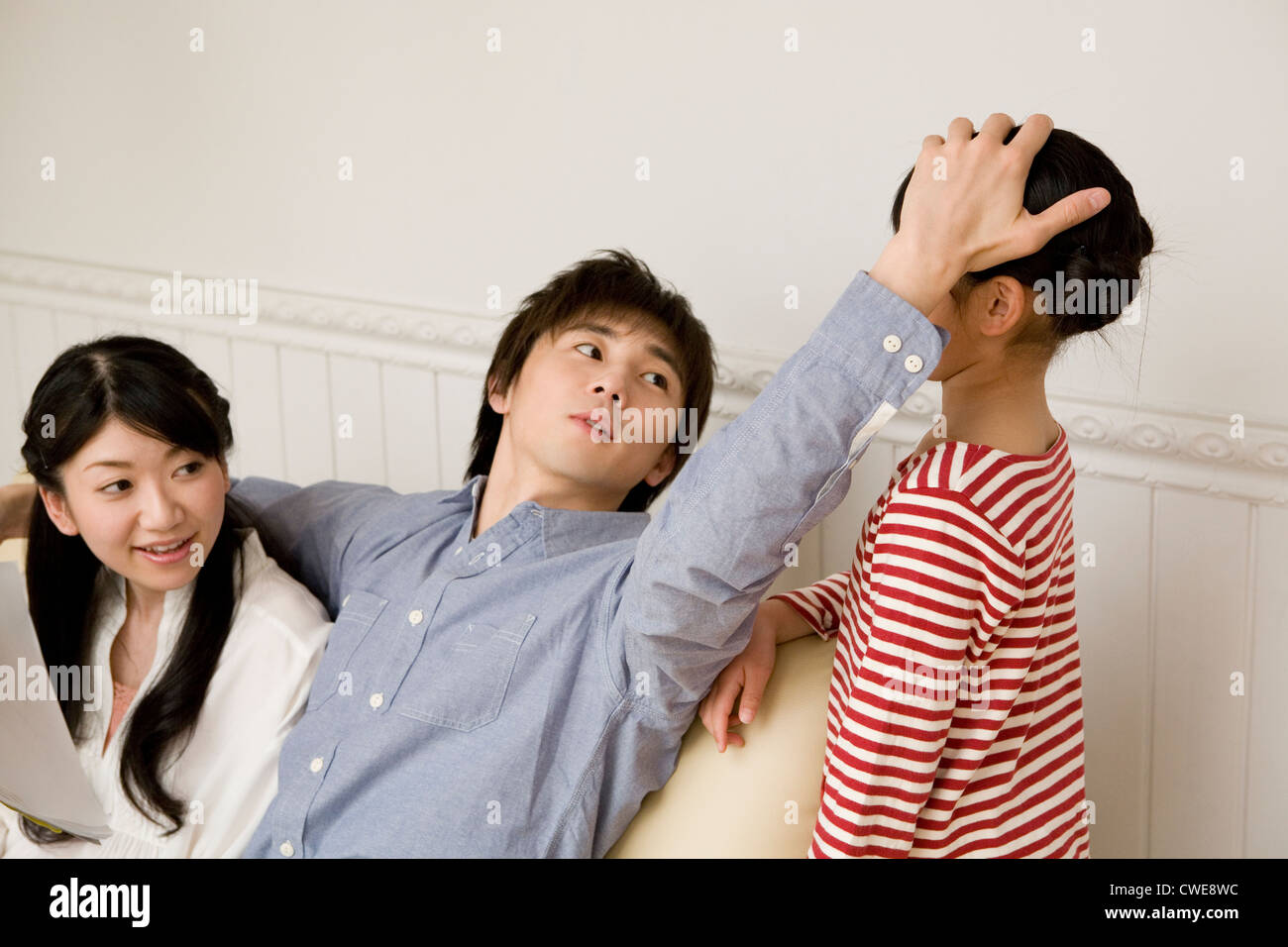 Father patting daughter Stock Photo - Alamy