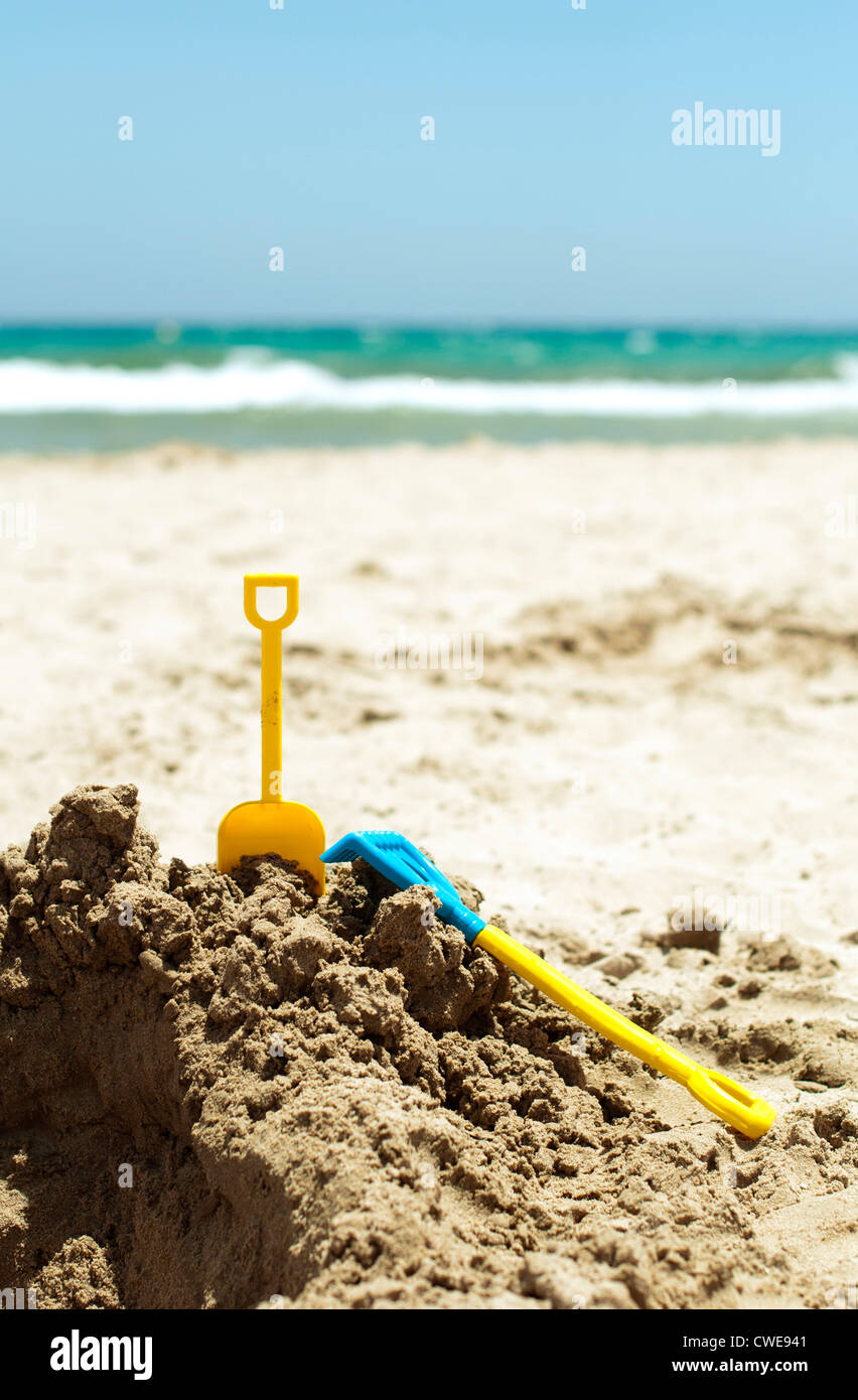 Toys in the sand on the beach Stock Photo - Alamy