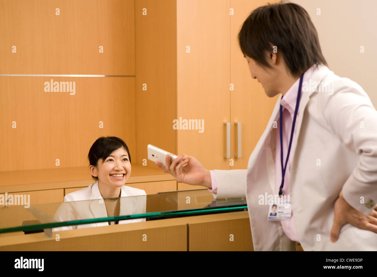 Receiving visitor hi-res stock photography and images - Alamy