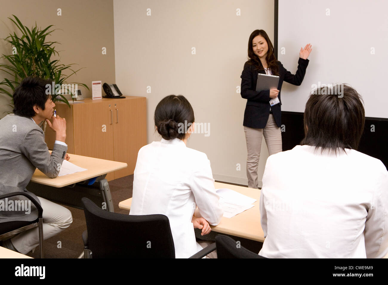 Businesswoman making presentation Stock Photo - Alamy