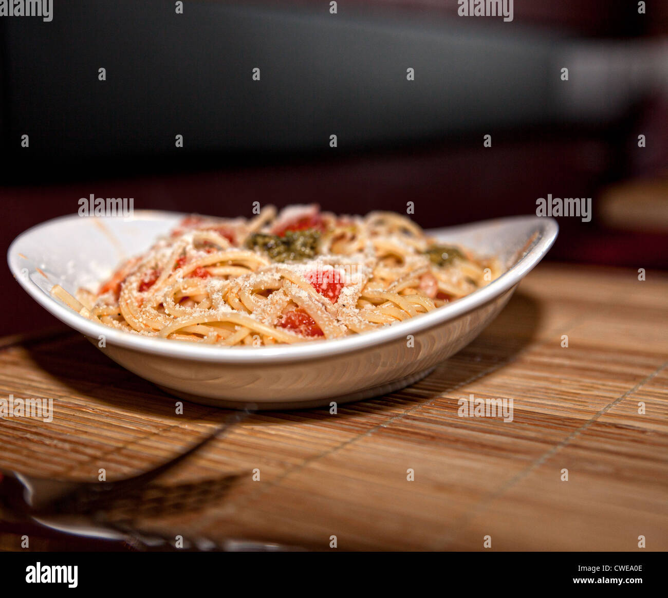 a of spaghetti on wooden table Stock Photo - Alamy