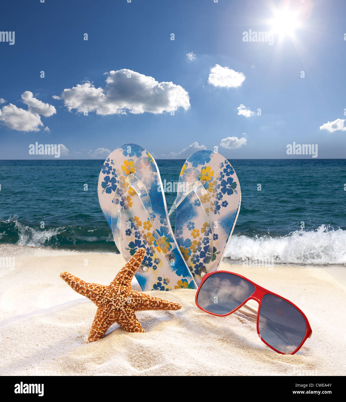 Starfish, sunglasses and flip flops on the beach Stock Photo - Alamy