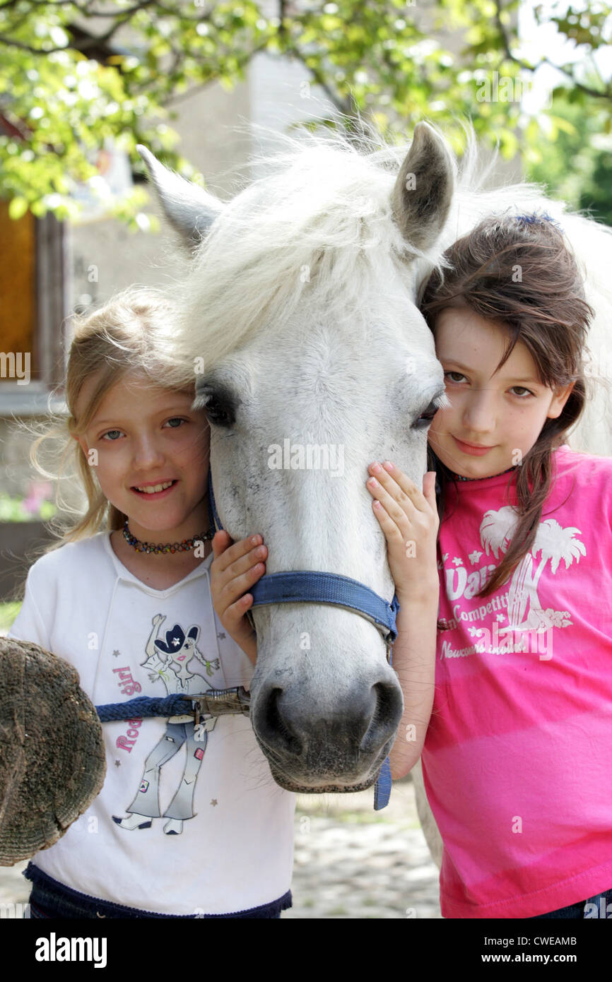 Wandlitz girl cuddling with her pony Stock Photo - Alamy