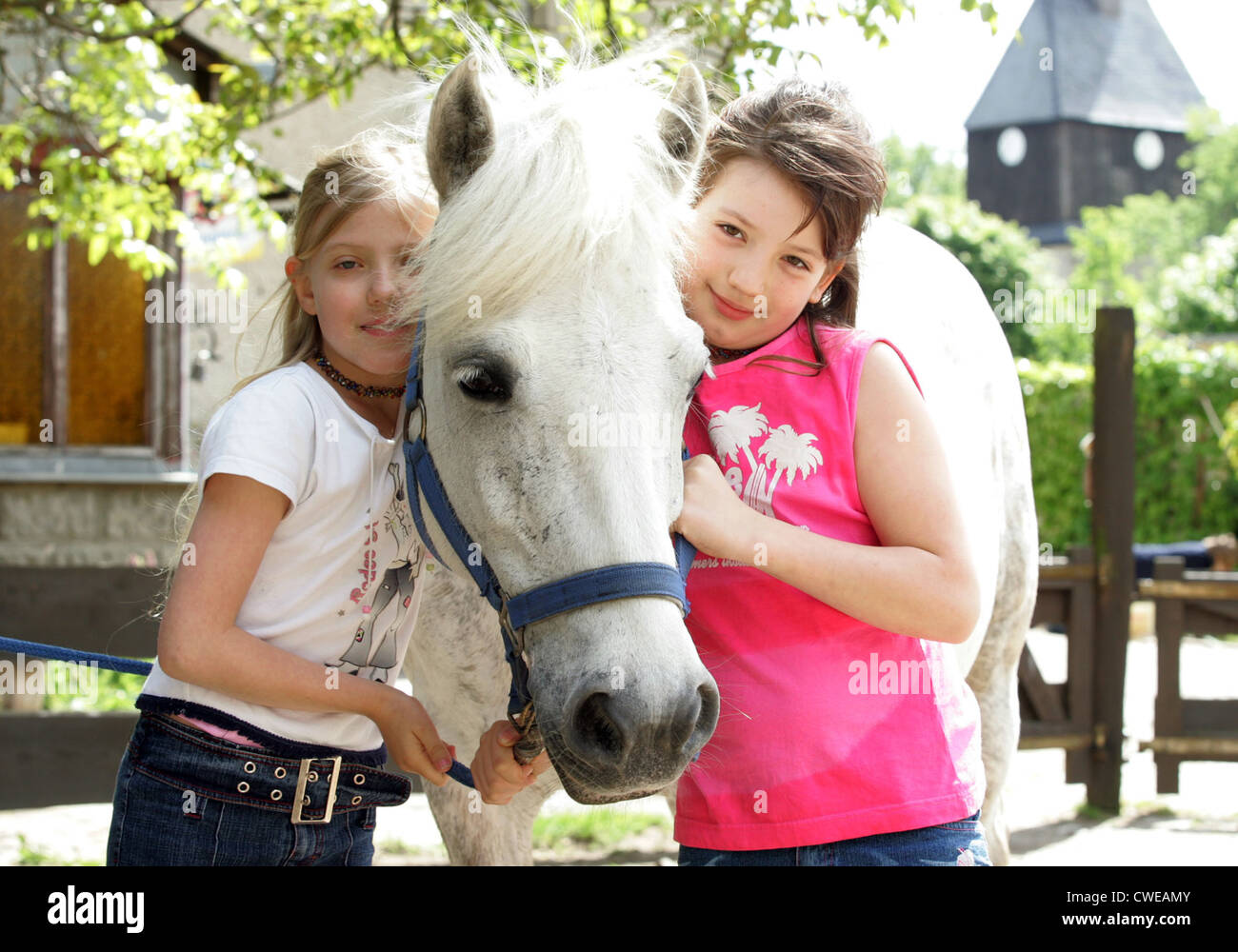 Wandlitz girl cuddling with her pony Stock Photo - Alamy