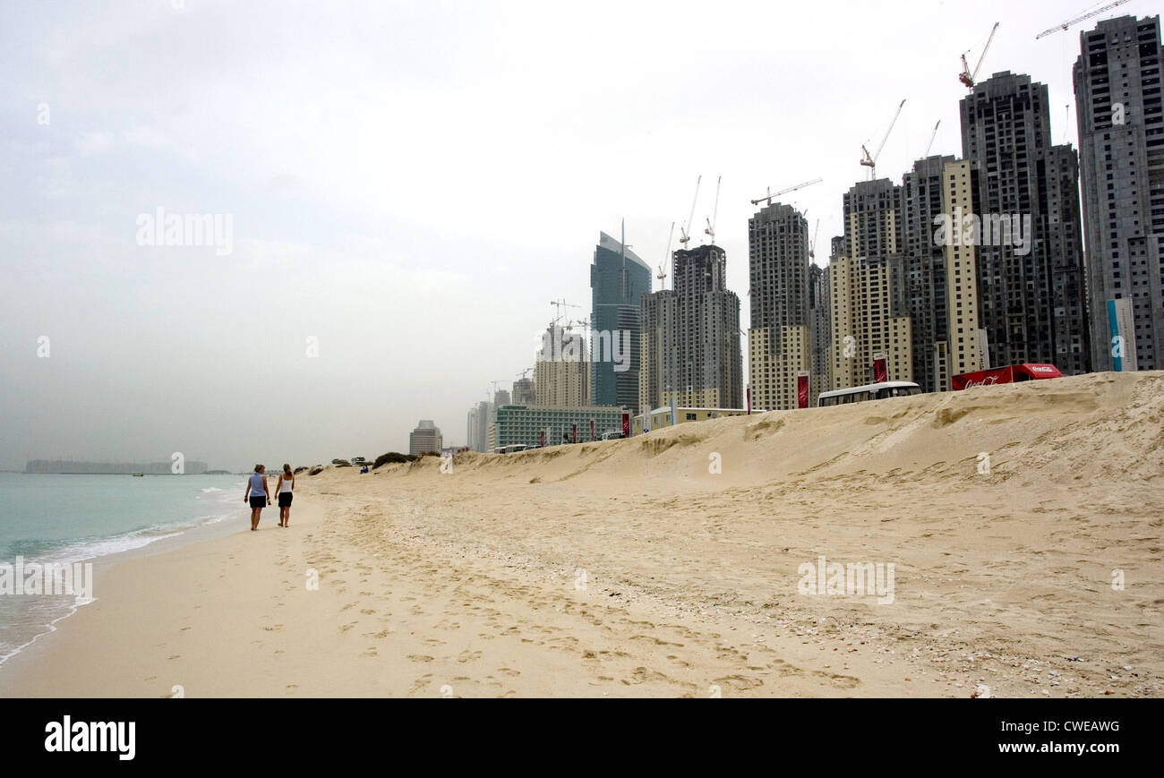 Dubai, the beach in front of the construction site at the Dubai Marina ...