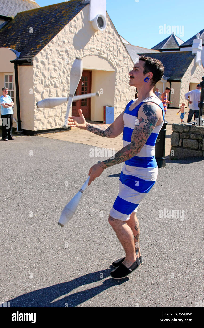 Juggling artist dressed in Victorian Swim-wear does his thing at the ...