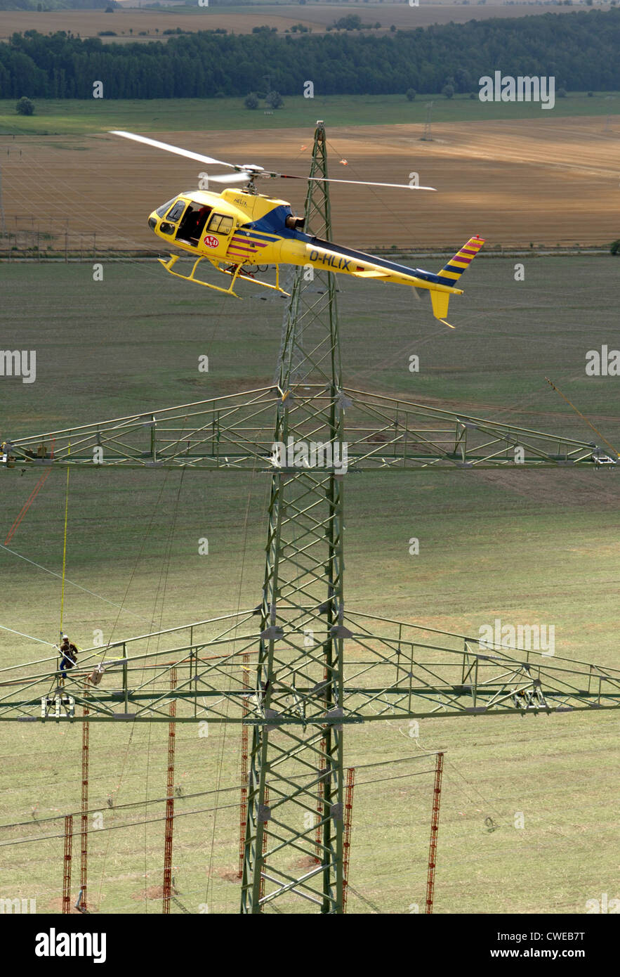 Freyburg, power line installation with a helicopter Stock Photo - Alamy