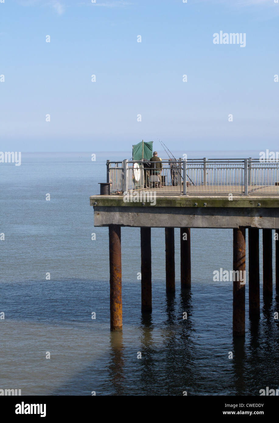 man fishing on the end of southwold pier southwold suffolk Stock Photo ...