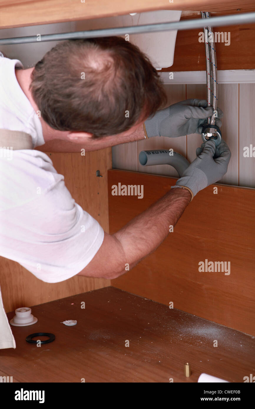 back view of a plumber Stock Photo - Alamy