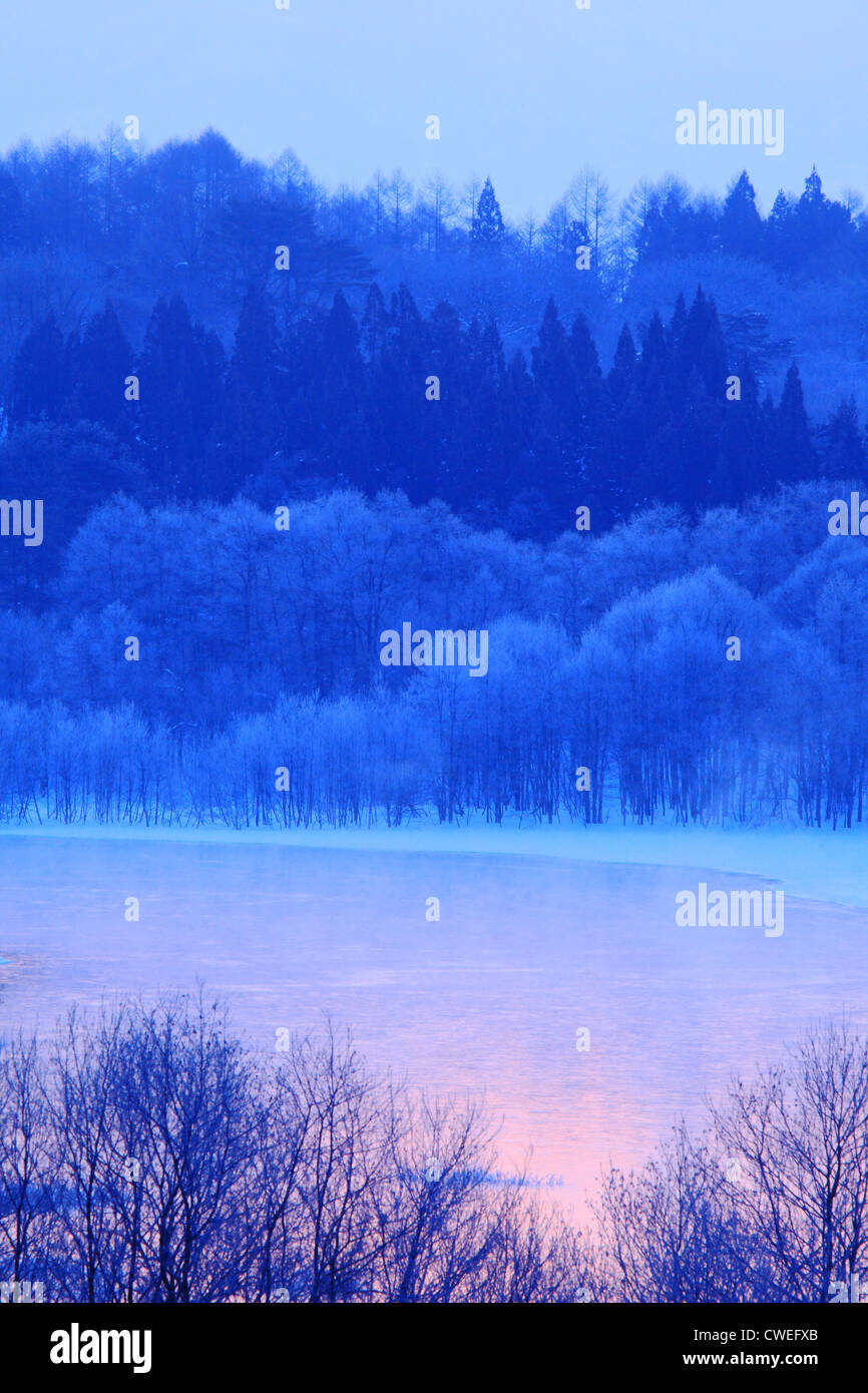 Trees, Water And Mountain At Dusk Stock Photo - Alamy