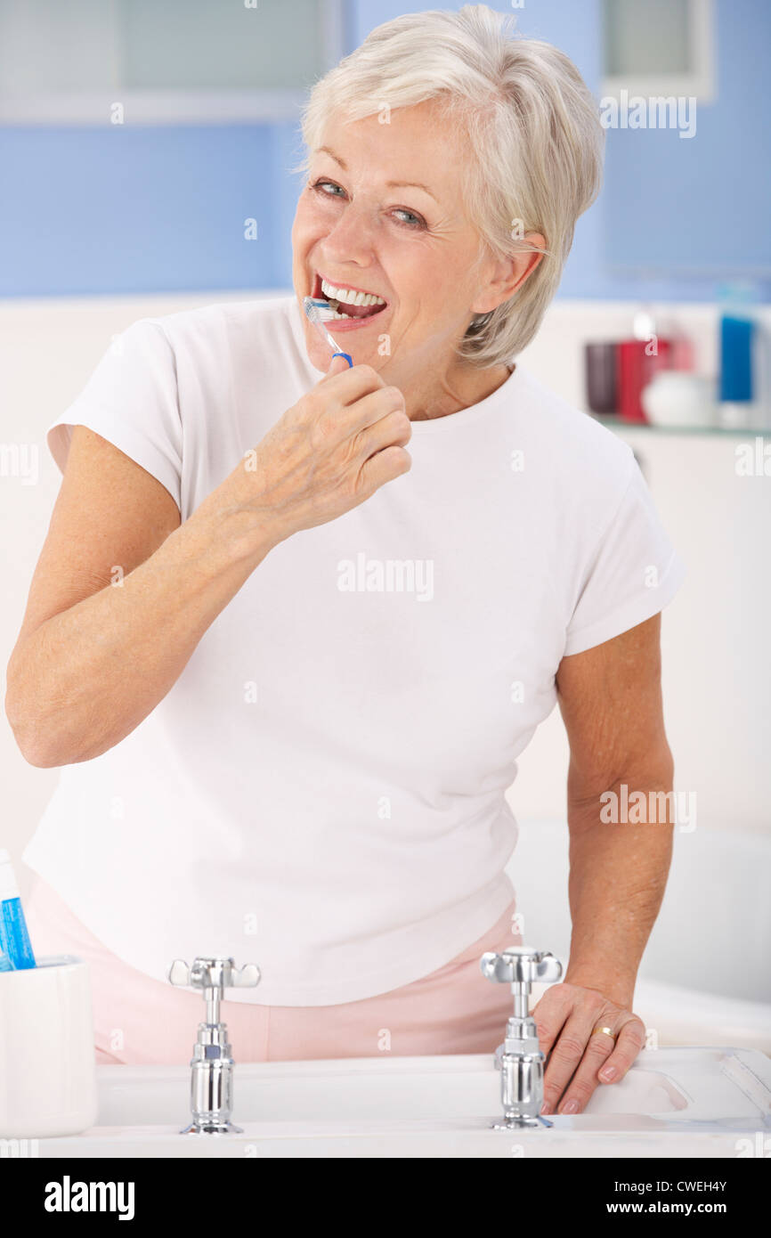 Senior woman brushing teeth Stock Photo - Alamy