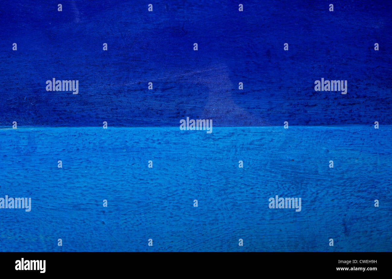 Detail of side of boat painted in two tones of royal or cobalt blue ...