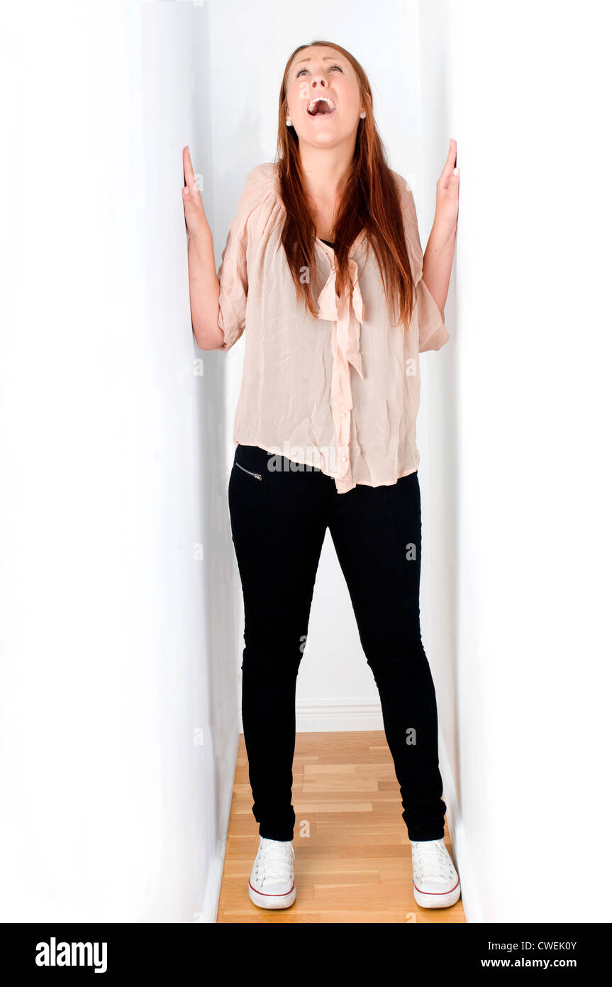 Young woman trapped in room hi-res stock photography and images - Alamy