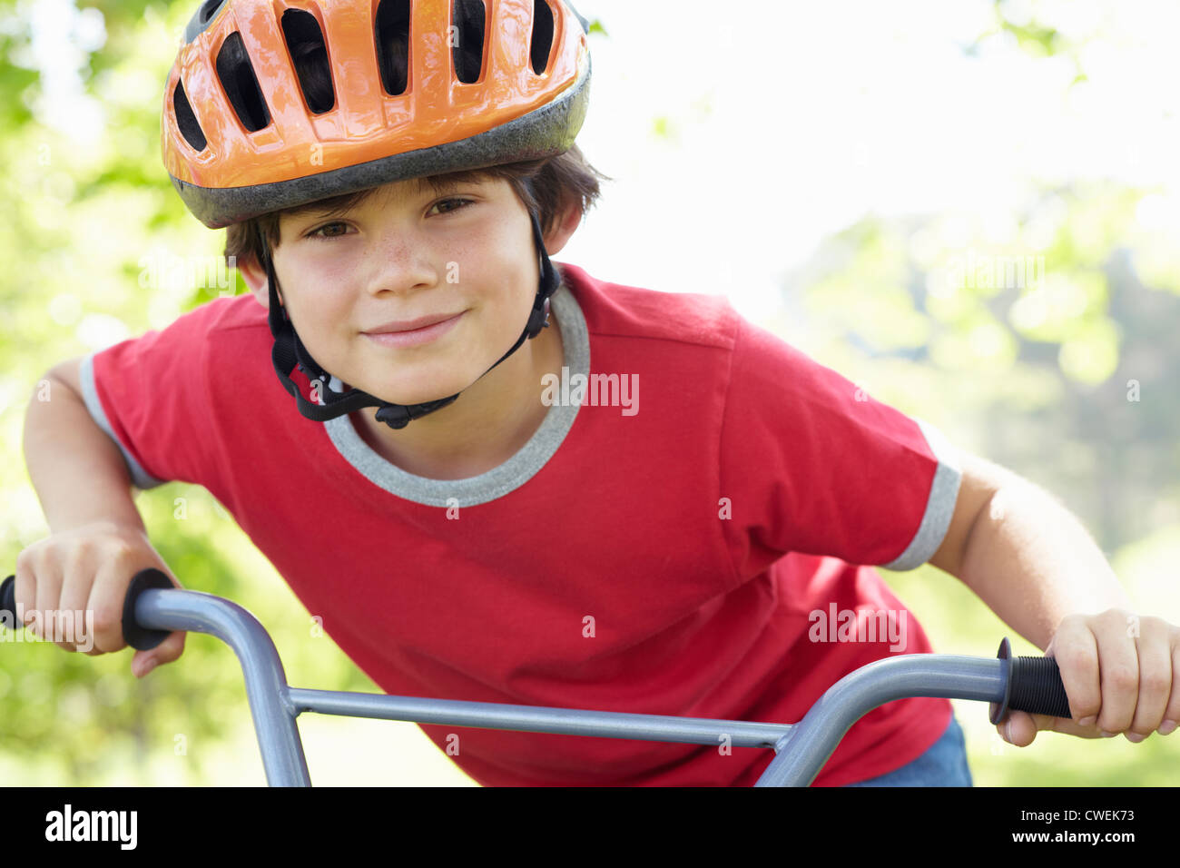 Boy riding bike Stock Photo - Alamy