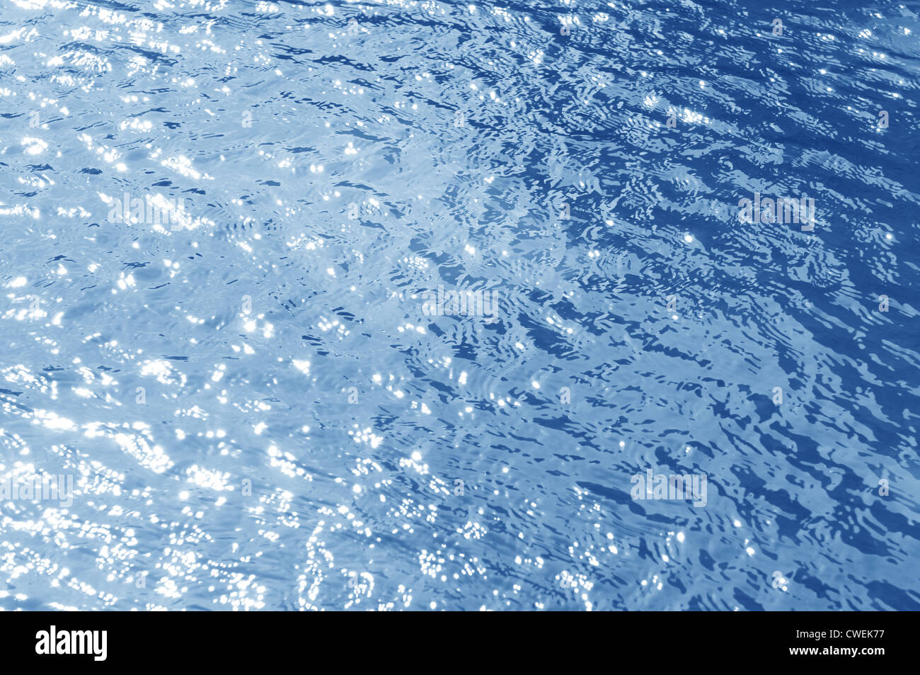 Abstract blue water surface reflecting sunlight suitable as background ...