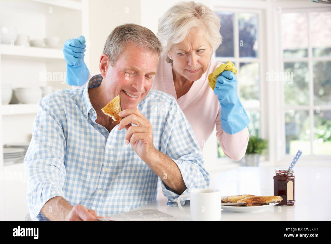 Retired man not helping with housework Stock Photo - Alamy